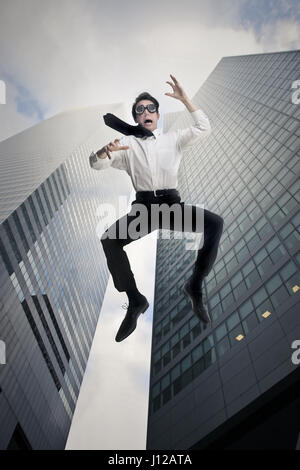 Man falling from skyscraper Stock Photo - Alamy