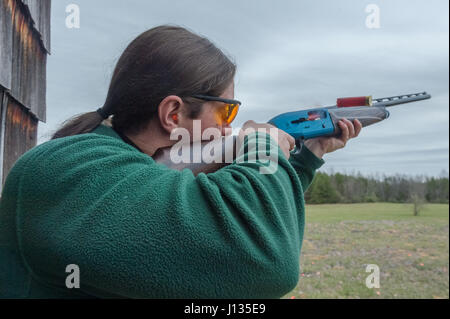 Jeff Madore fires a shotgun during a skeet shooting competition hosted ...