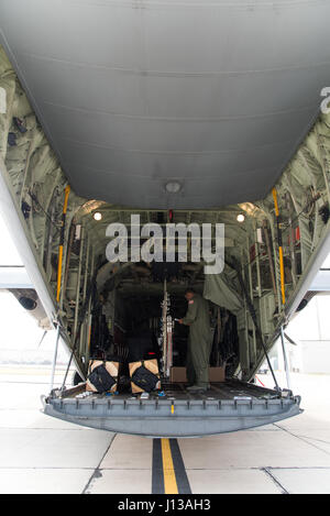 Loadmasters from the 53rd Weather Reconnaissance Squadron prepared and ...