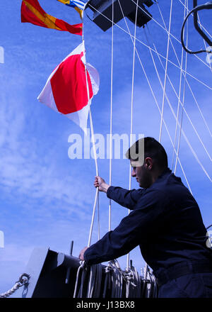 US Navy Quartermaster First Class Michael Harvey controls the throttles ...