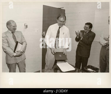 An individual receives an award during a formal honors ceremony at ...