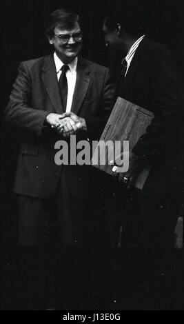 An individual receives an award during a formal honors ceremony at ...