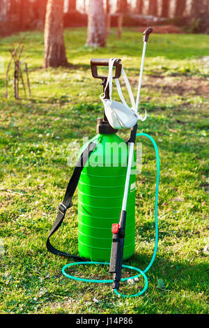 green sprayer on spring garden Stock Photo - Alamy