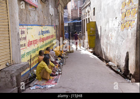 Beggar sitting on road vrindavan uttar pradesh, india, asia Stock Photo ...