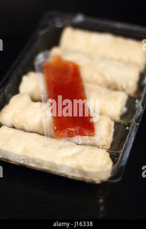 Spring roll in disposable plastic tray Stock Photo - Alamy