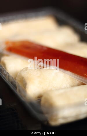 Spring roll in disposable plastic tray Stock Photo - Alamy