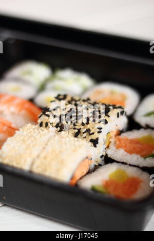 Assorted sushi tray with maki, hosomaki, california uramaki, bean ...