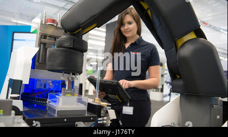 Stuttgart, Germany. 18th Apr, 2017. A Bosch employee operates an Apas ...