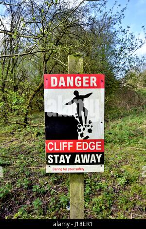 Danger Cliff Edge Stay Away sign outside a quarry in the Peak District ...