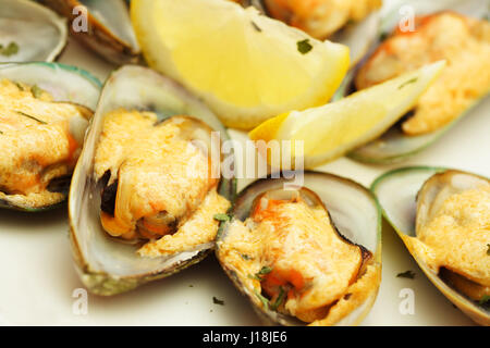 Baked mussels with mayonnaise Stock Photo - Alamy