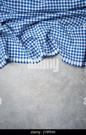 Blue folded tablecloth on gray stone table Stock Photo - Alamy