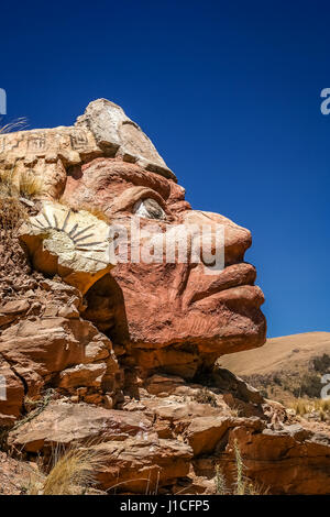 Stone Inca face sculpture on the shore of Lake Titicaca in Peru Stock ...
