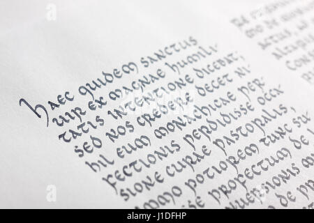 Close up view of ancient writing. Medieval uncial script. Latin ...