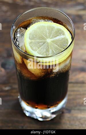 Glass of iced cola with a lemon slice Stock Photo - Alamy