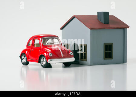 Izmir, Turkey - April 1, 2017: Red toy car and miniature house on a ...
