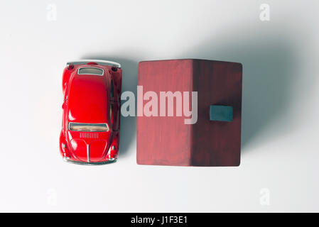 Izmir, Turkey - April 1, 2017: Red toy car and miniature house on a ...