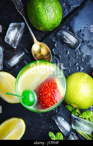 Cocktail glass with ice and ime green cocktail Stock Photo - Alamy