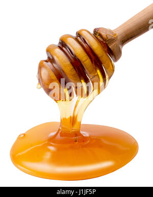 dropping honey isolated on a white background Stock Photo - Alamy