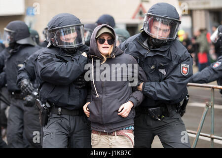Police Officers detain a protestor during a demonstration against the ...