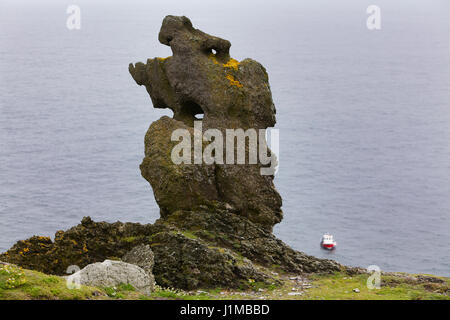 An impressive rock structure on Skellig Michael with a ferry from ...