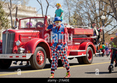 Clowns on firetruck during a street parade - USA Stock Photo - Alamy