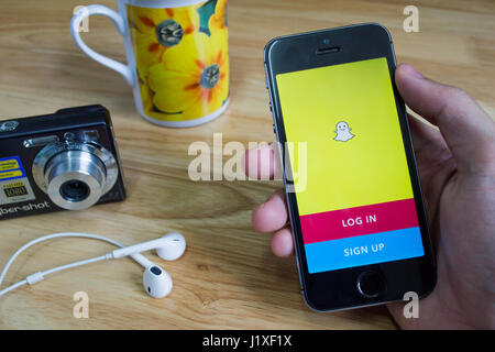 Bangkok, Thailand - April 22, 2017 : Apple iPhone5s in a mug showing ...