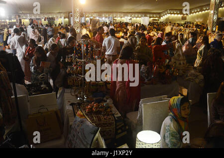 Lahore, Pakistan. 23rd Apr, 2017. Pakistani people takes interest in ...