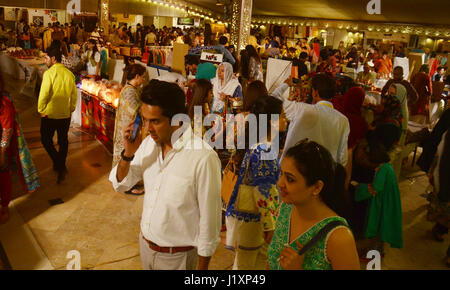 Lahore, Pakistan. 23rd Apr, 2017. Pakistani people takes interest in ...