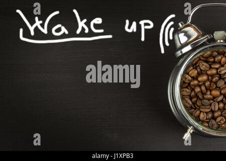 Retro alarm clock with coffee beans. Morning coffee after waking up ...