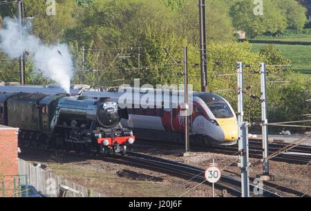 EDITORIAL USE ONLY (left to right) The Flying Scotsman and Virgin Trains' new Azuma arrive at ...