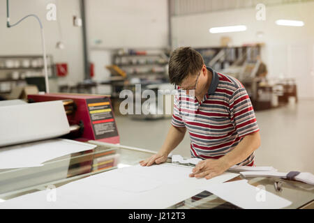 Creative designer working on fabric swatches and color palettes in her ...