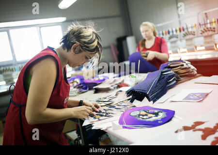 Fabric designers industry workers working with textile Stock Photo - Alamy