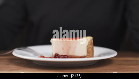 teenage girl eating cheesecake with strawberry jam, 4k photo Stock ...