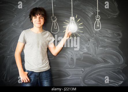 Teenager boy getting an idea Stock Photo - Alamy