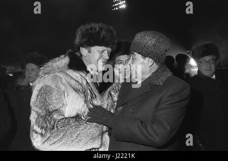 Soviet President Leonid Brezhnev, right, shakes hands and kisses U.S ...