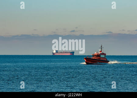 Orange pilot ship moving fast in Baltic sea. Europe Stock Photo - Alamy