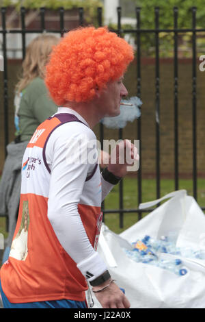 London Marathon Runner has a cigarette break. runner smoking Stock ...