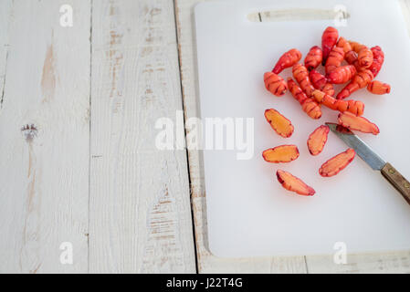 oca tubers being prepared for cooking in a kitchen Stock Photo - Alamy
