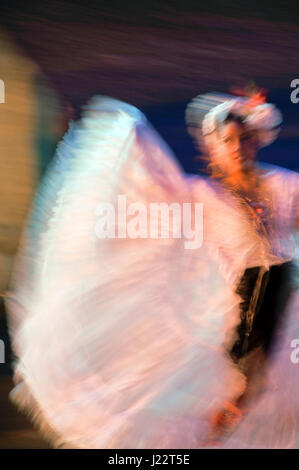 Maya folklore dancer performing in traditional dress at Xcaret Park ...