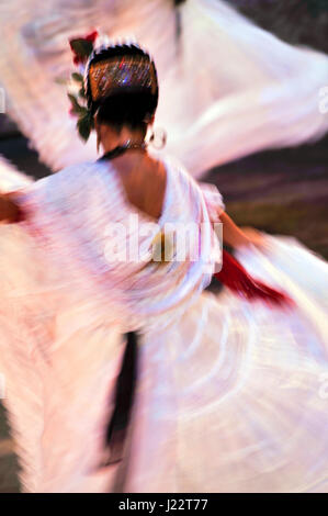 Maya folklore dancer performing in traditional dress at Xcaret Park ...
