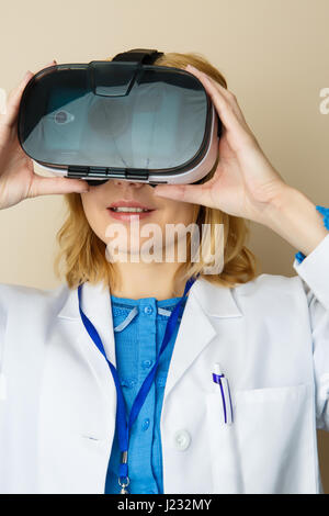 Girl in virtual reality mask experiencing virtual technology world ...