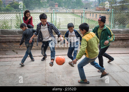 Nepalese children playing a game in the village of Jagat, Manaslu Stock ...