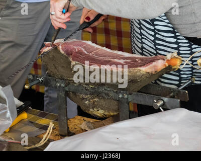 Waiter is slicing raw ham,italian Stock Photo - Alamy