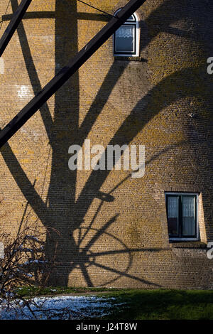 Windmills or wind turbine and shadow on wind farm in rotation to ...