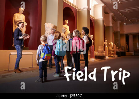 Pupils And Teacher On School Field Trip To Museum With Guide Stock ...