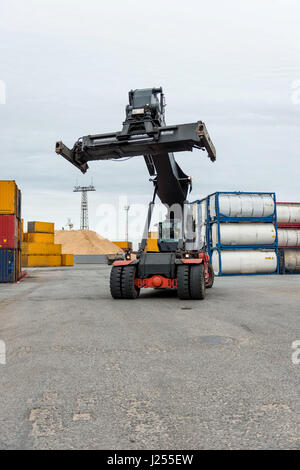Mobile stacker handler in action at a container terminal Stock Photo ...