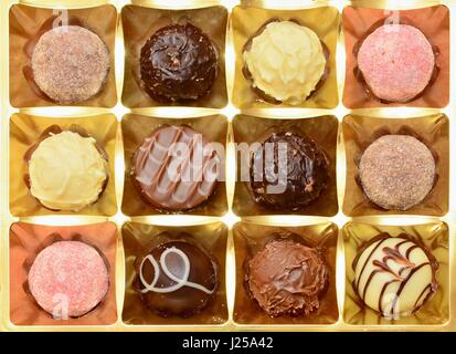 Closeup view of box of chocolates with variety chocolates pralines ...