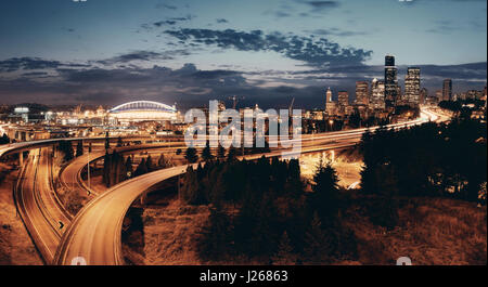 Seattle city view with urban architecture and traffic light trail at ...