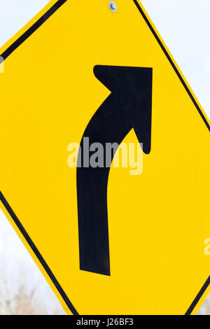 Traffic sign to indicate right turn. Arrow curved on a billboard in the ...