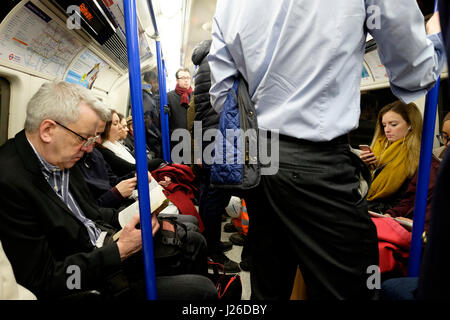 crowded packed London underground tube train on the Central line ...